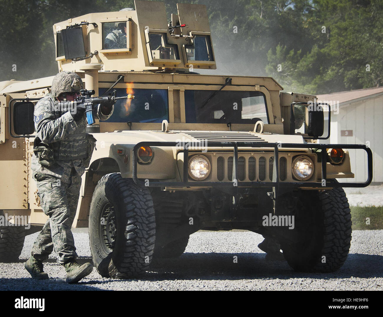 Staff Sgt. Matthew Krause fires his M-4 rifle during a demonstration ...