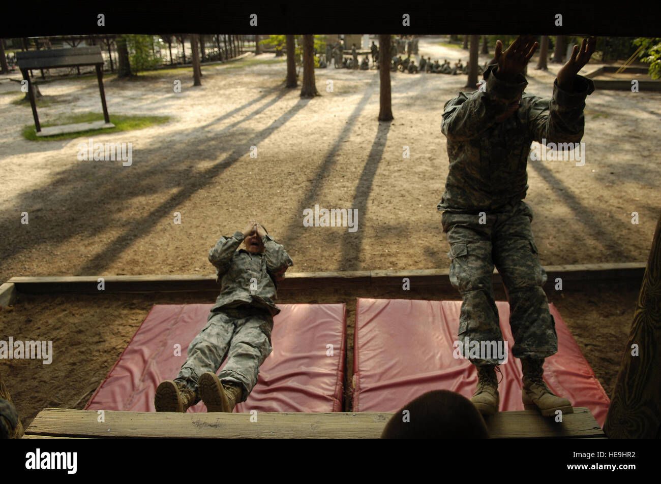 U.S. Army recruits drop from the platform obstacle at the confidence ...