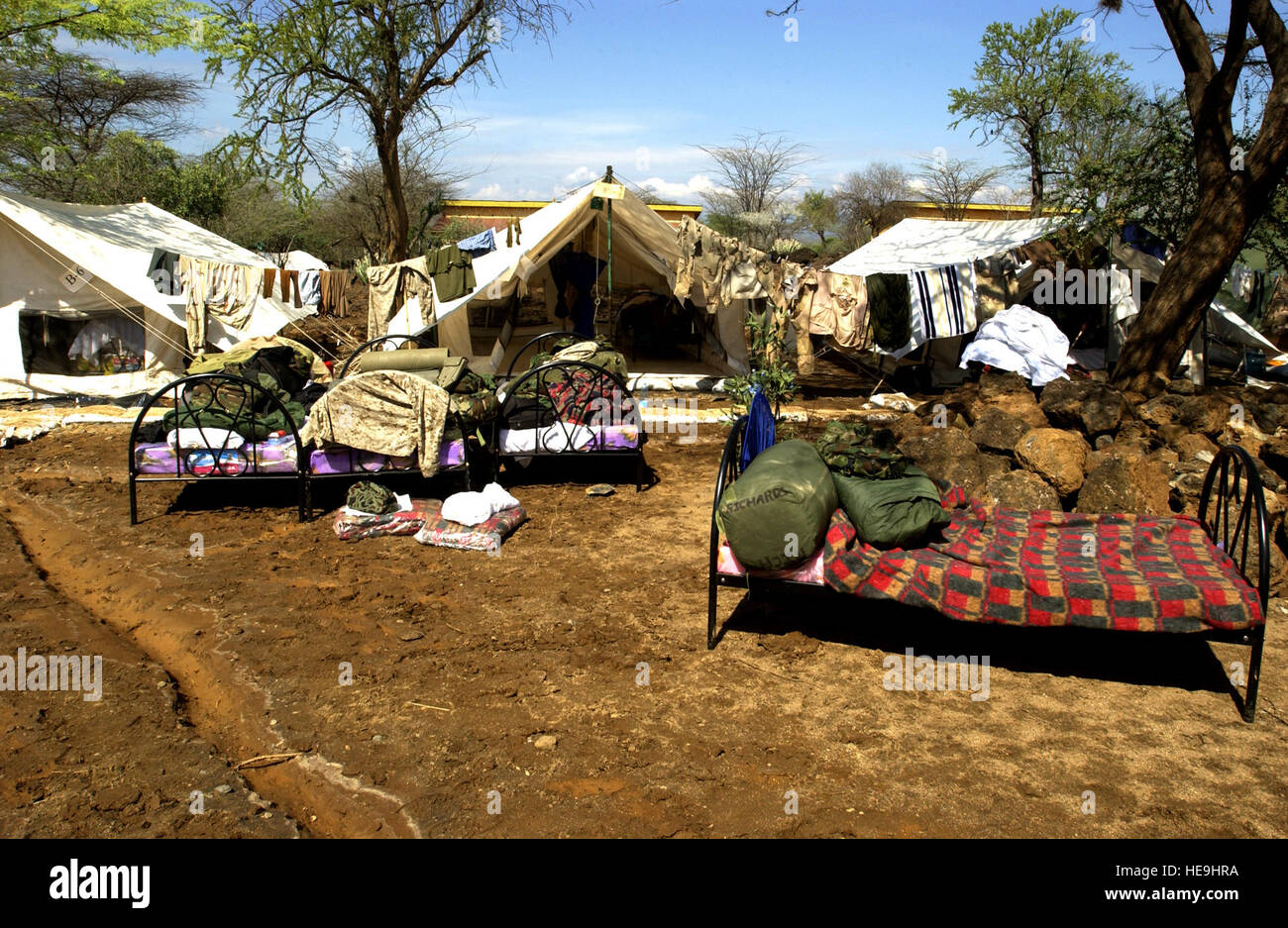 Bunks are dried outdoors after flooding at a U.S. military headquarters ...