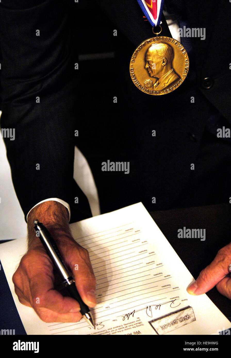 Defense Secretary Donald H. Rumsfeld signs his autograph at the ...