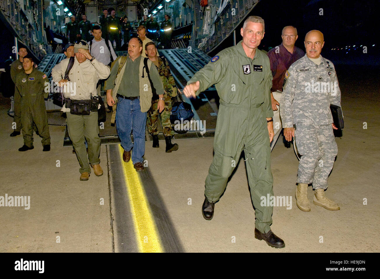 At the top of the cargo ramp of a C-17 Globemaster III, Keith Stansell ...