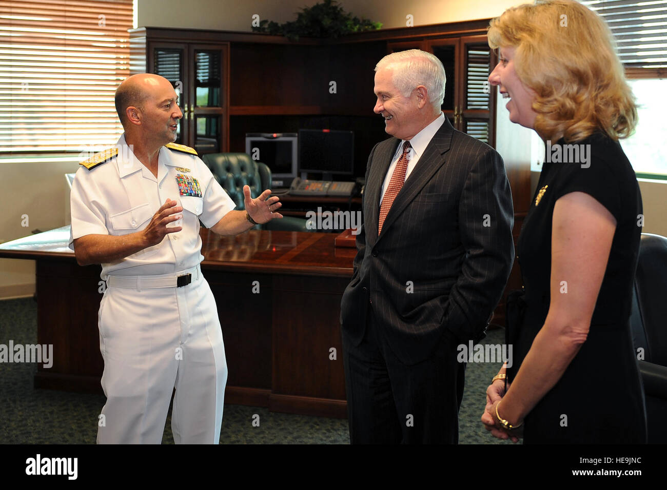U.S. Defense Secretary Robert M. Gates(middle) talks with Navy Adm ...