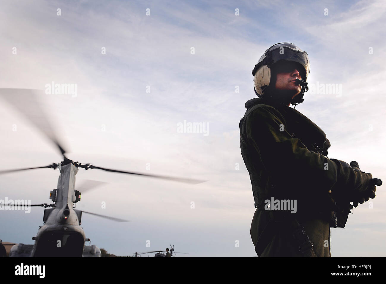 A U.S. Marine Corps CH-46 Sea Knight helicopter crew chief prepares to ...