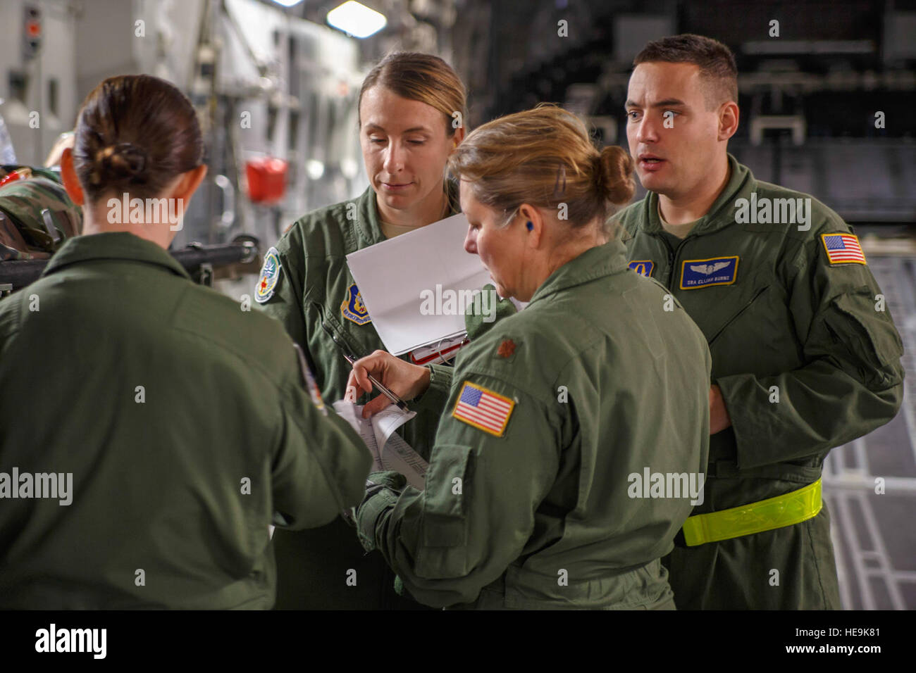 Air Force Reserve Maj. Shana Weber (center), a flight nurse with the ...
