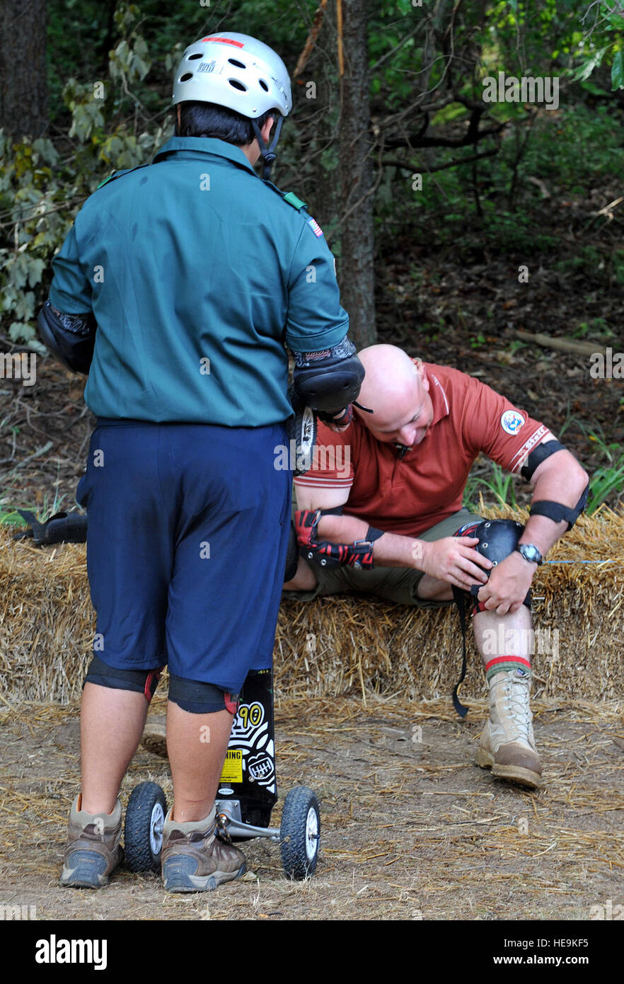 U.S. Navy Lt. Cmdr. James Pickens, puts his safety gear on while his ...