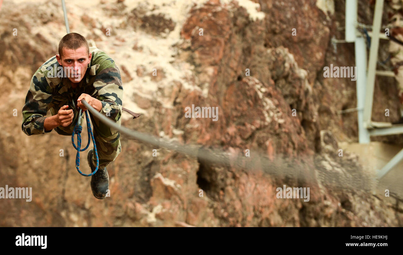 A French Marine, 5th French Marine Regiment, crosses a high wire rope ...