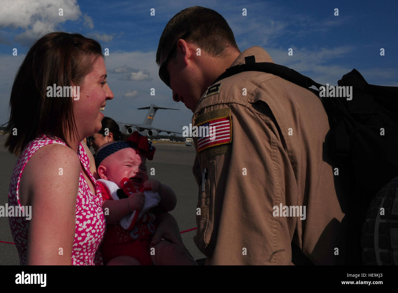 Whitney Hooper holds five month old daugther Grace Hooper while ...