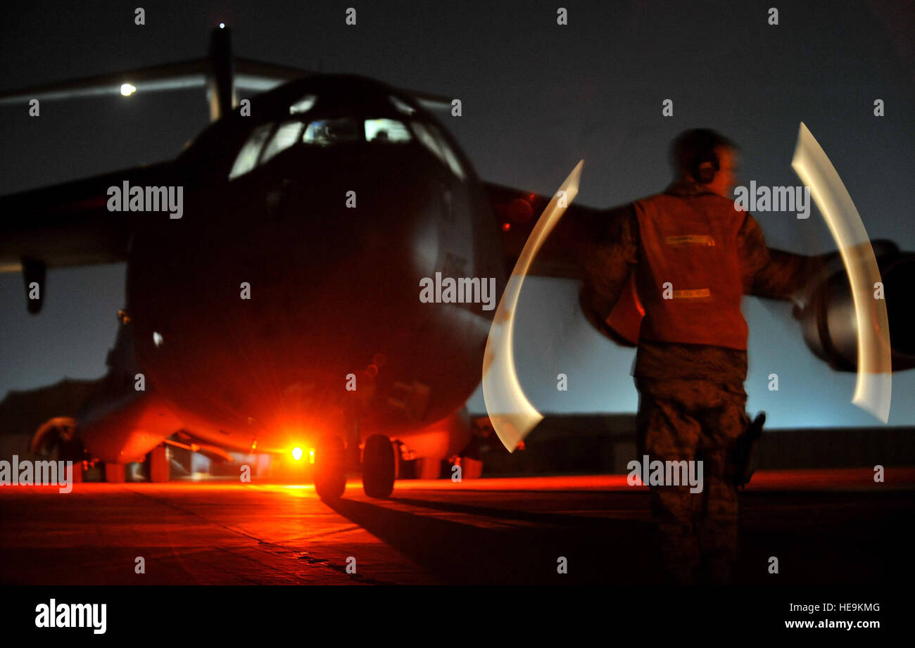 Staff Sergeant directs a C-17 Globemaster III aircraft to its assigned ...