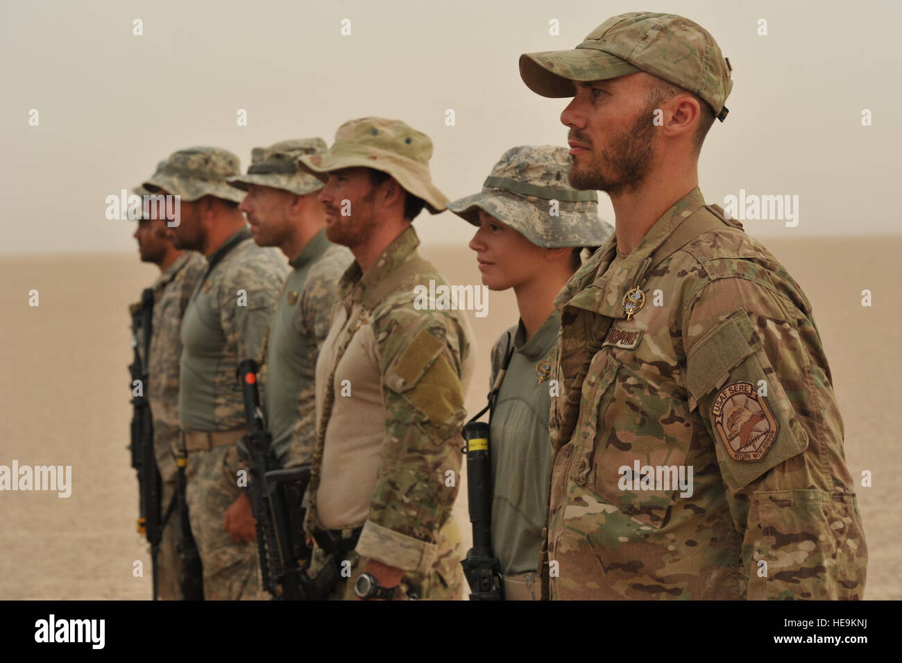 U.S. Airmen, Soldiers, Sailors and Marines stand in formation prior to ...