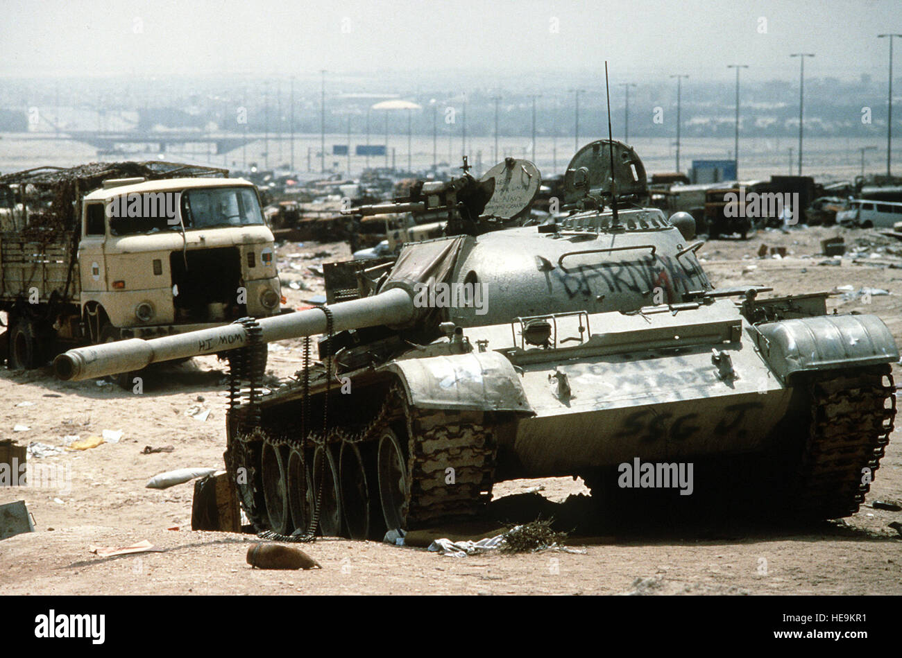 A destroyed Iraqi T-55 main battle tank, painted with graffiti by ...
