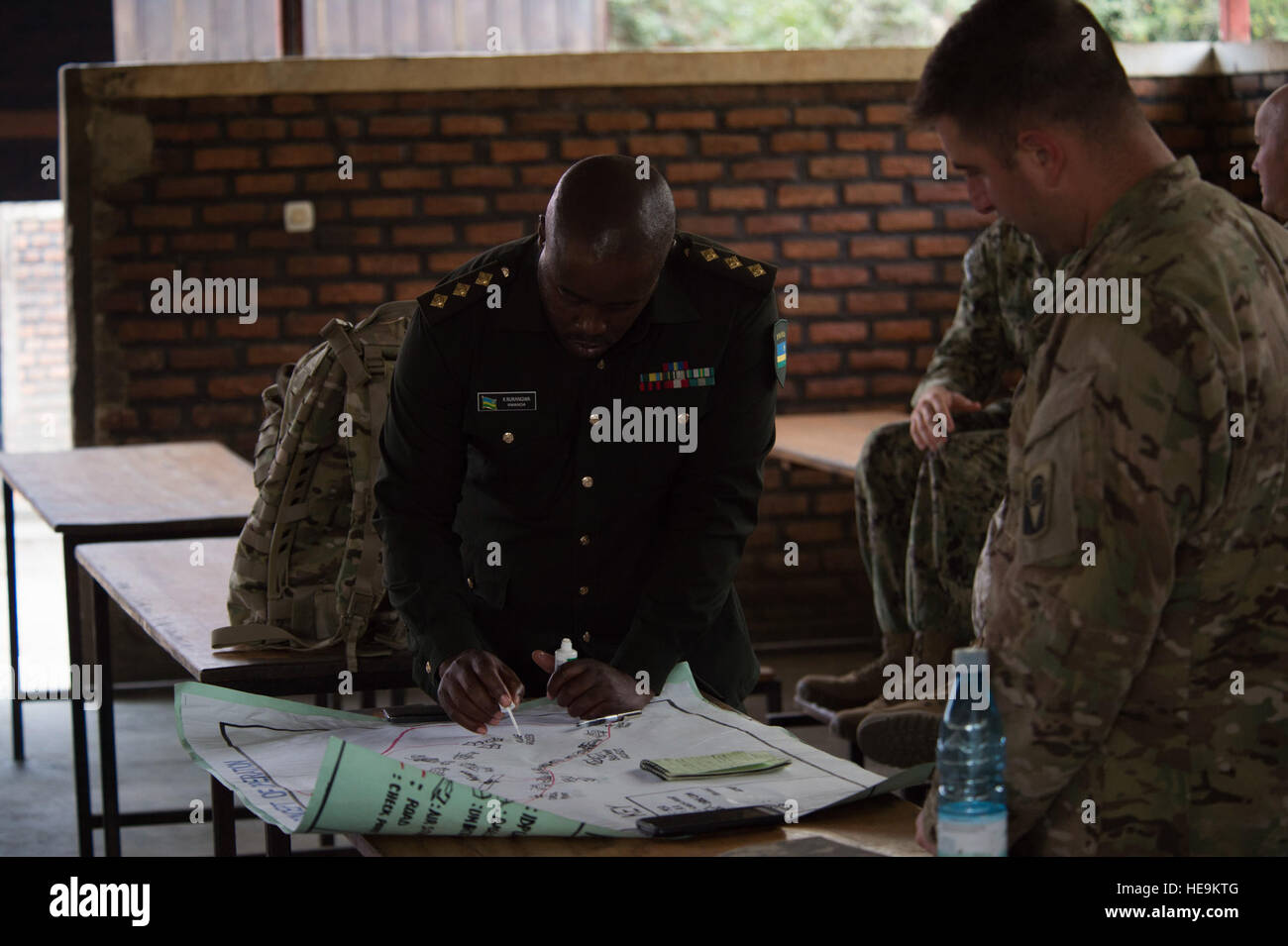 A Rwanda Defense Force captain and U.S. Army 1st Sgt. Jason Krenta, 1st ...