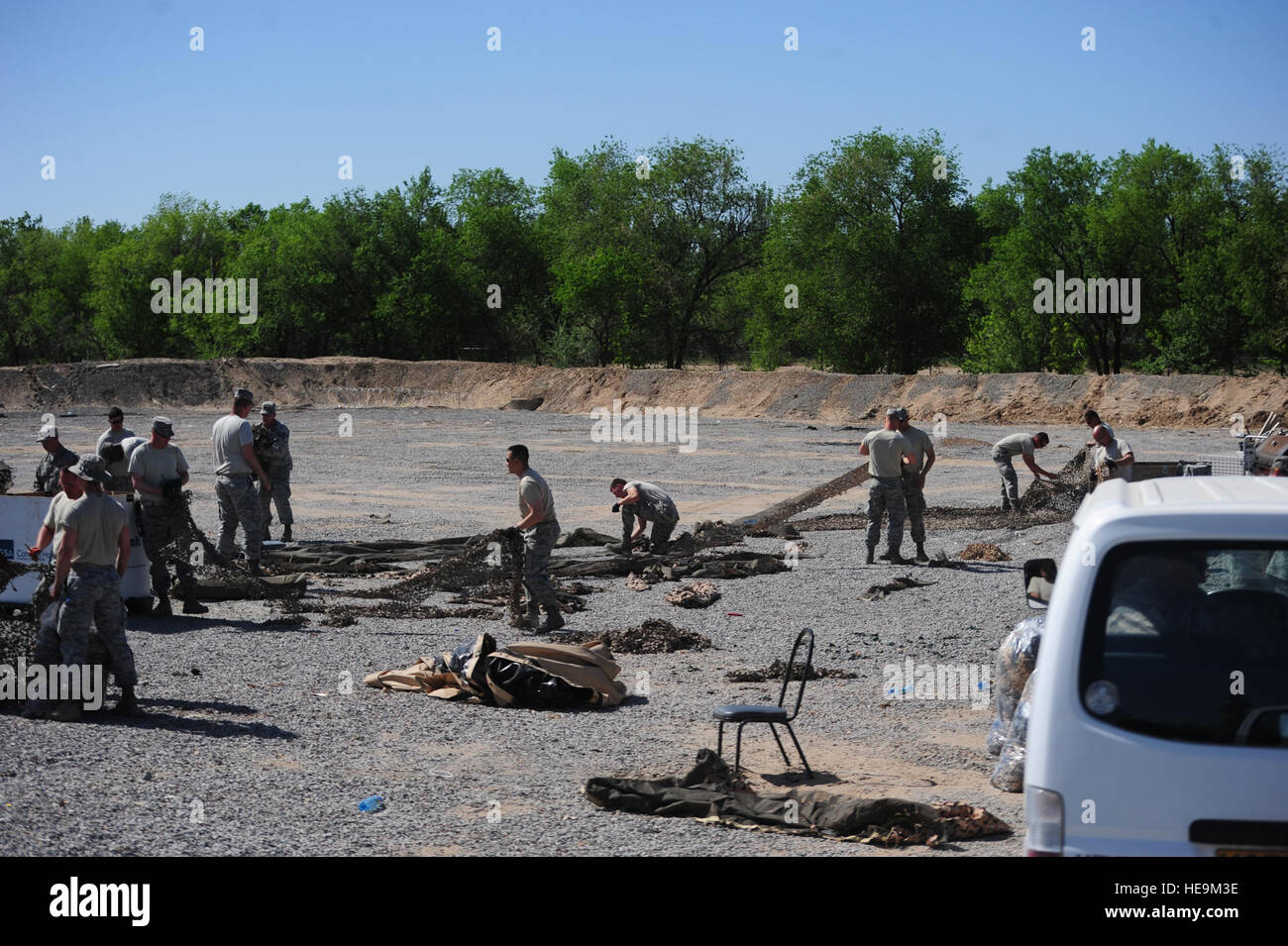 Airmen from the 376th Air Expeditionary Wing demilitarize camouflage ...