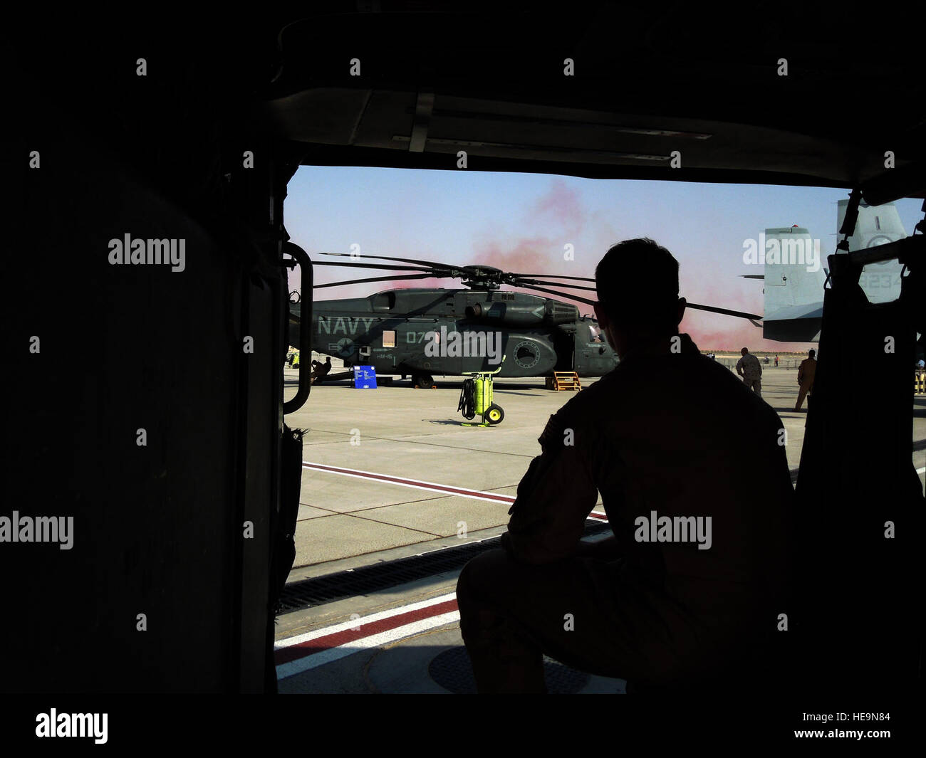 Lt. j.g. Kevin Primeau, Navy MH-60 pilot, watches air show performances ...