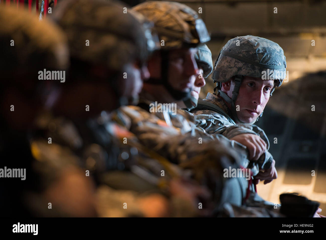 An Army jumpmaster from the 725th Brigade Support Battalion receives ...