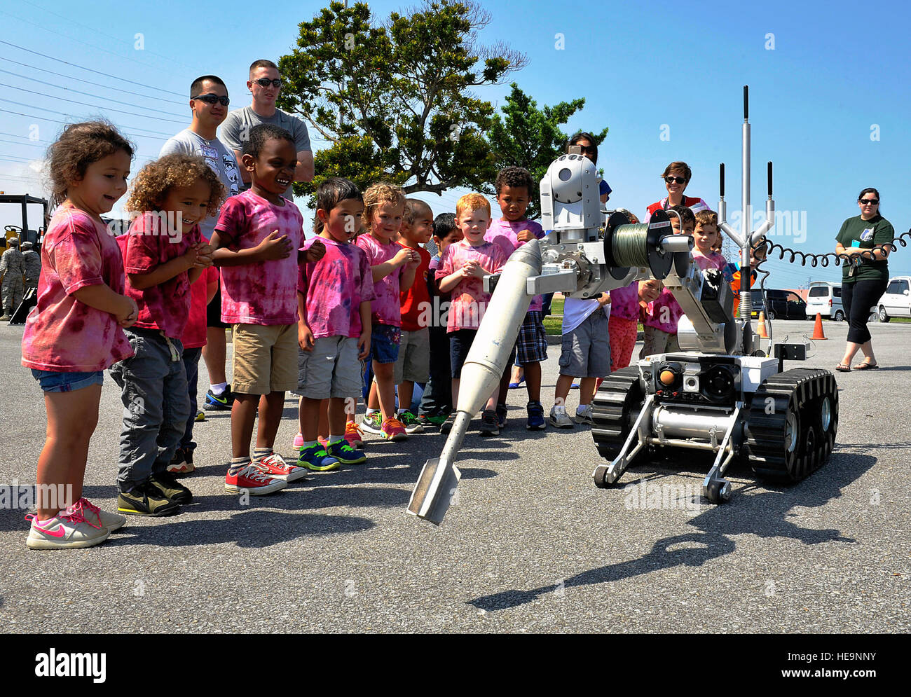 Children from the Niko-Niko Child Development Center, watch as an ...