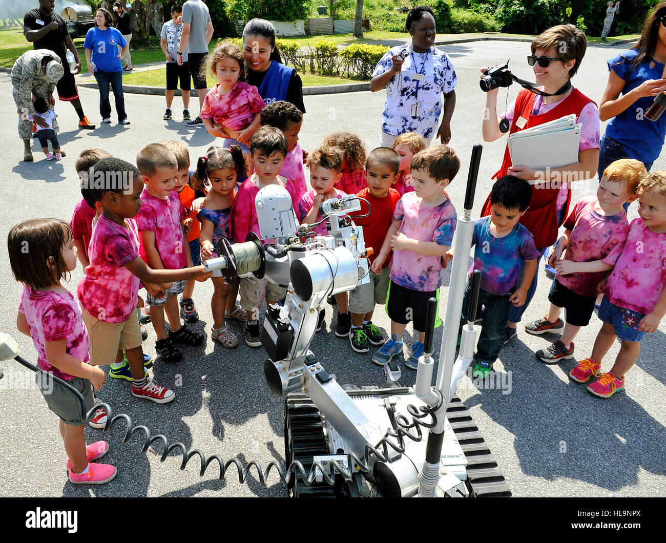 Children from the Niko-Niko Child Development Center, gather around an ...