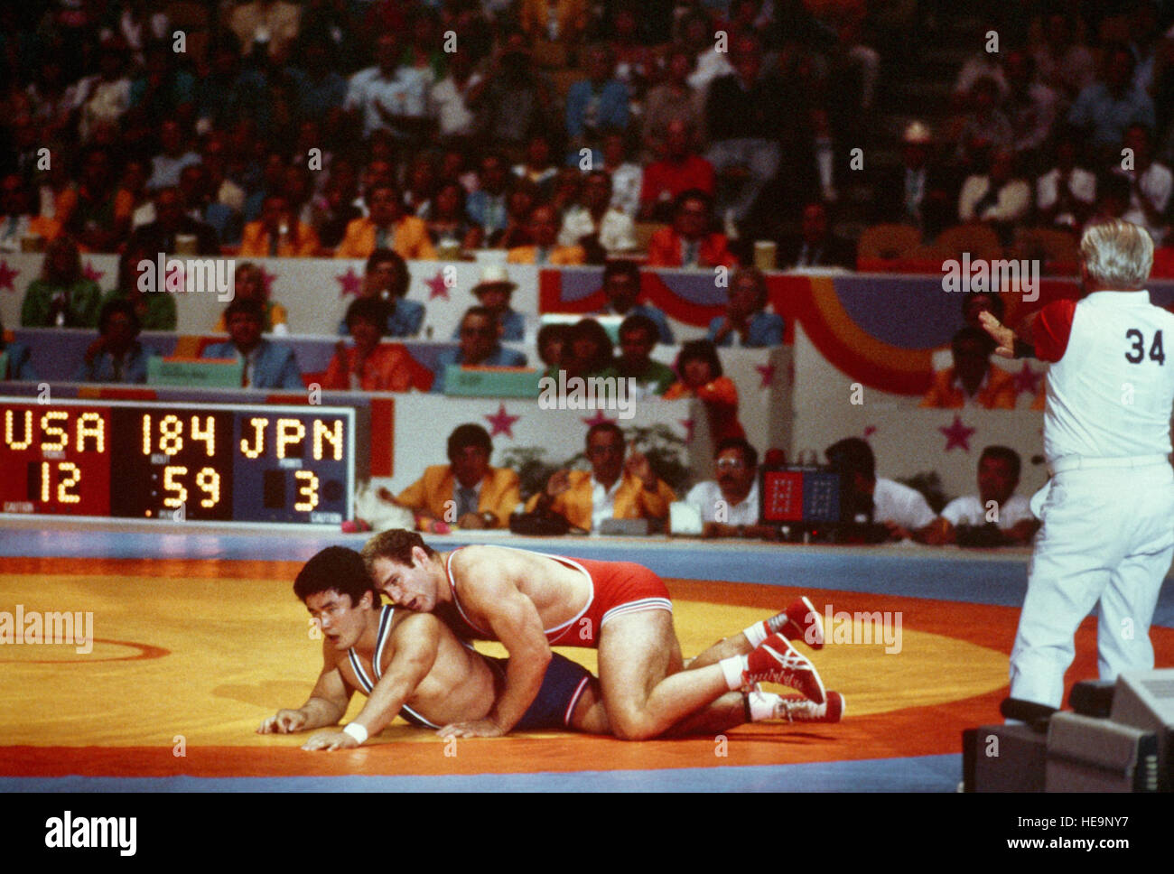 Ed Banach, in red, wrestles Akira Ohta of Japan during the 1984 Summer ...