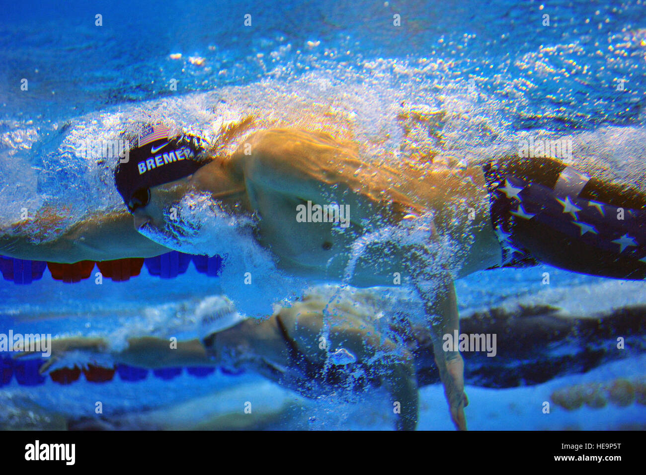 A U.S. Army captain completes the 200-meter freestyle swimming portion ...