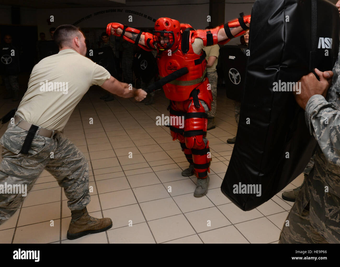 A civil engineer squadron technician participates in ASP baton training ...