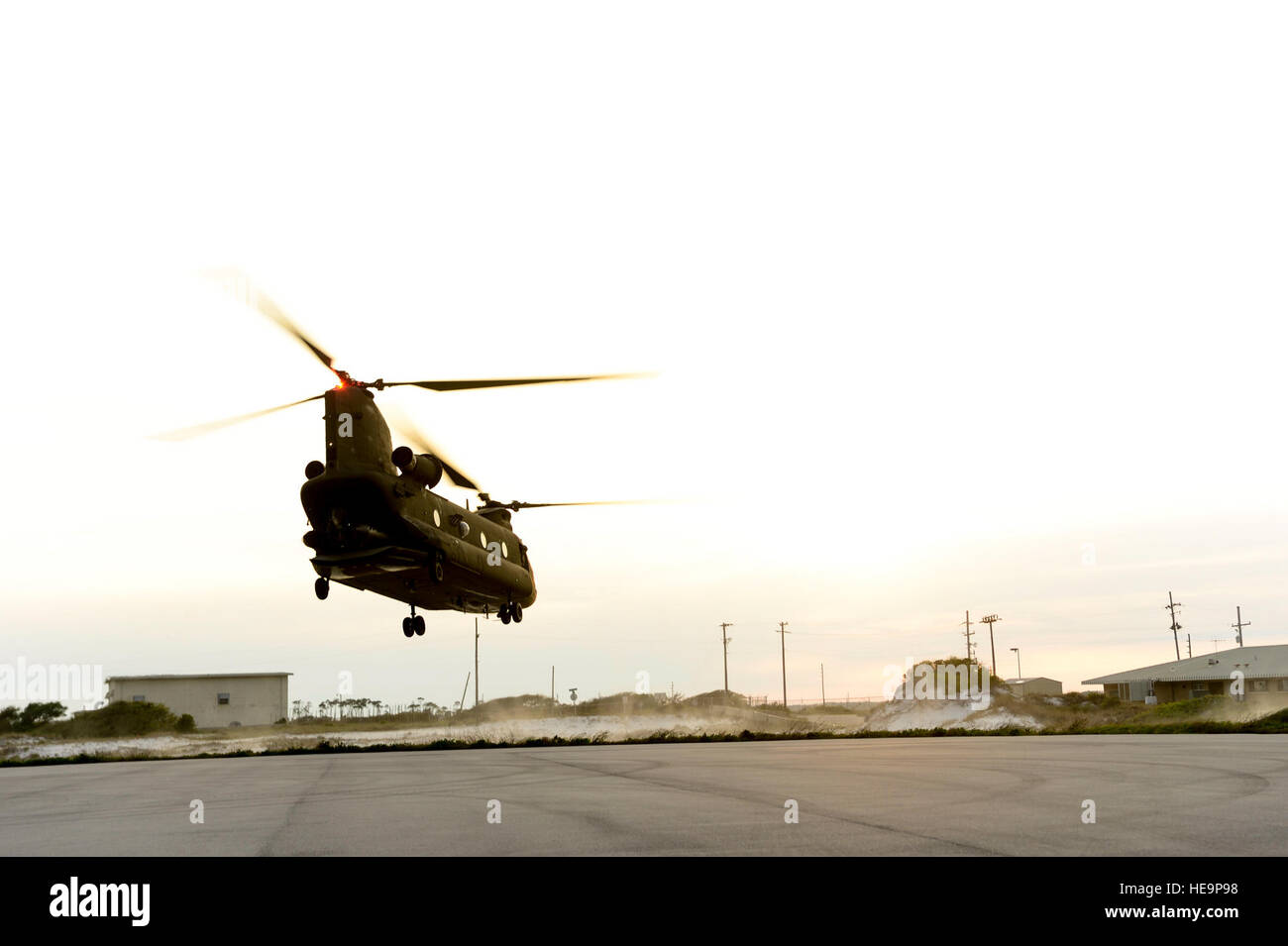 A U.S. Army CH-47 Chinook helicopter takes off to practice helocast ...