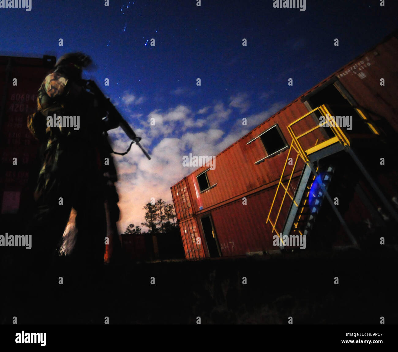 A U.S. Army Soldier conduct a night raid mission during Emerald Warrior ...