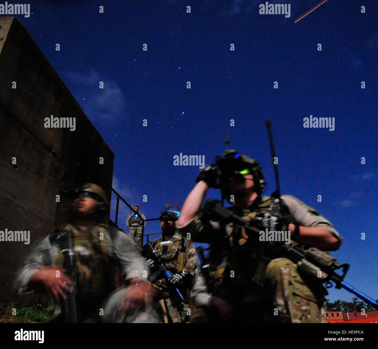 U.S. Army Soldiers conduct a night raid mission during Emerald Warrior ...
