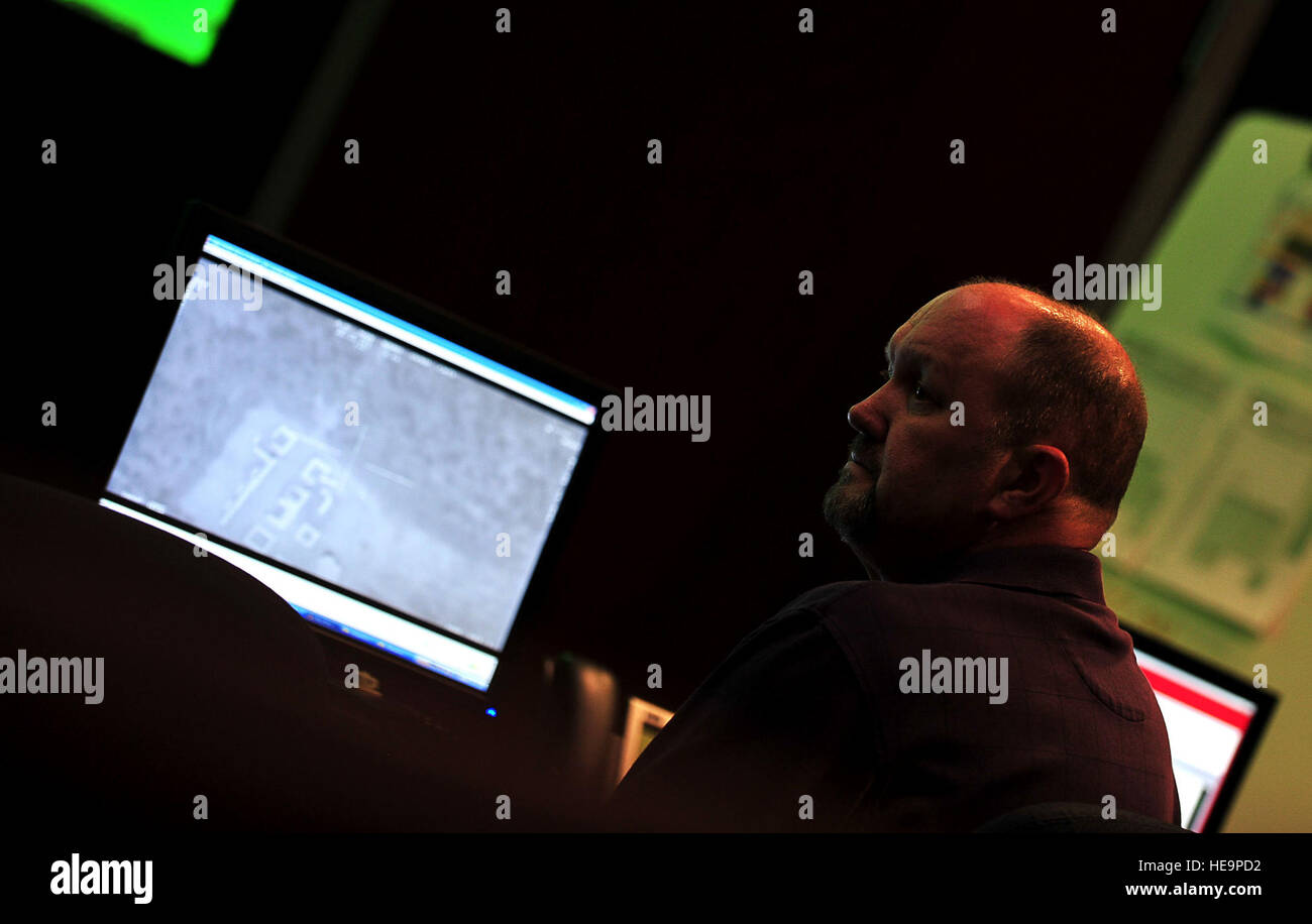 A Lockheed Martin civilian observes a simulator training session during ...