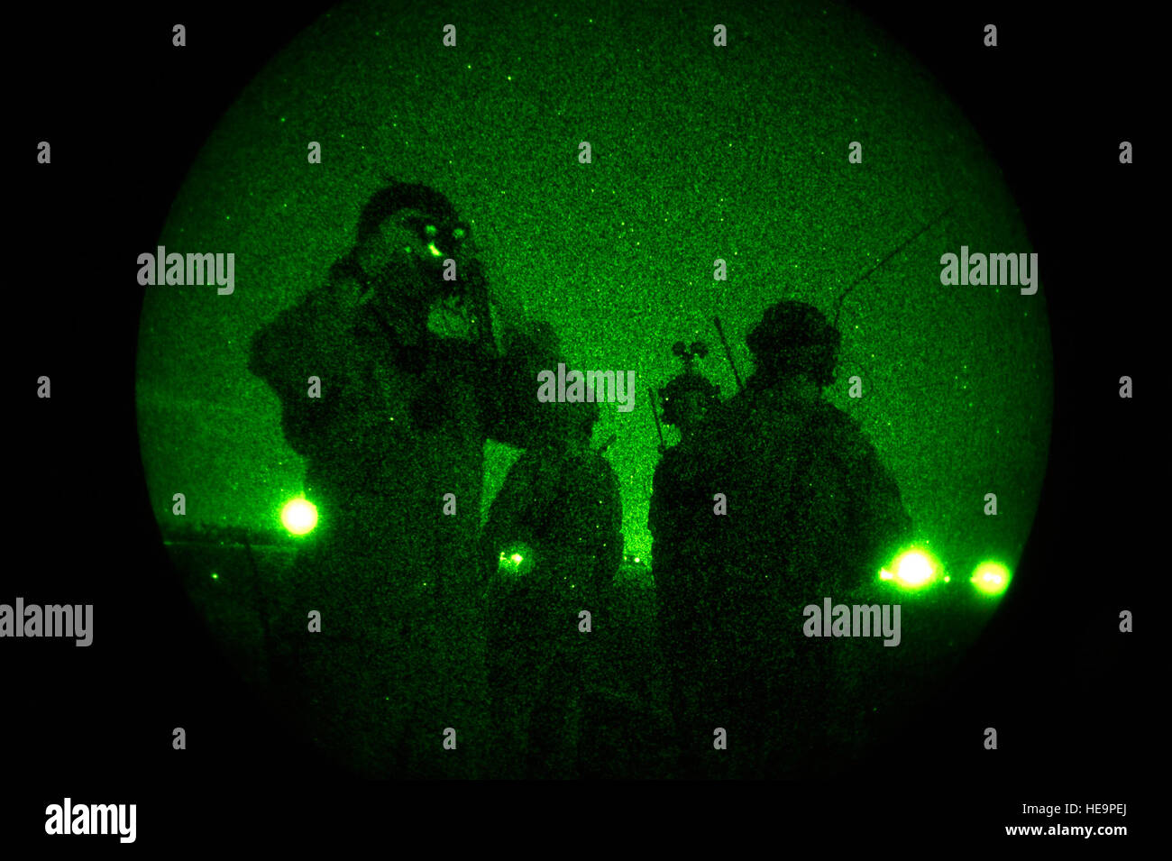 Members of the 21st Special Tactics Squadron use night vision goggles ...