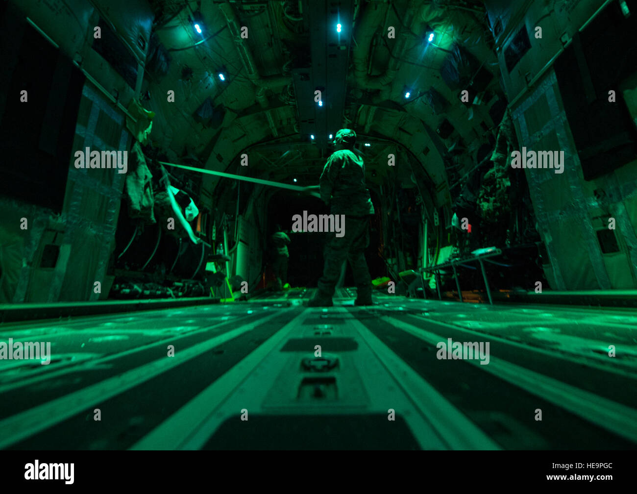 A U.S. Air Force 9th Special Operations Squadron loadmaster secures a ...