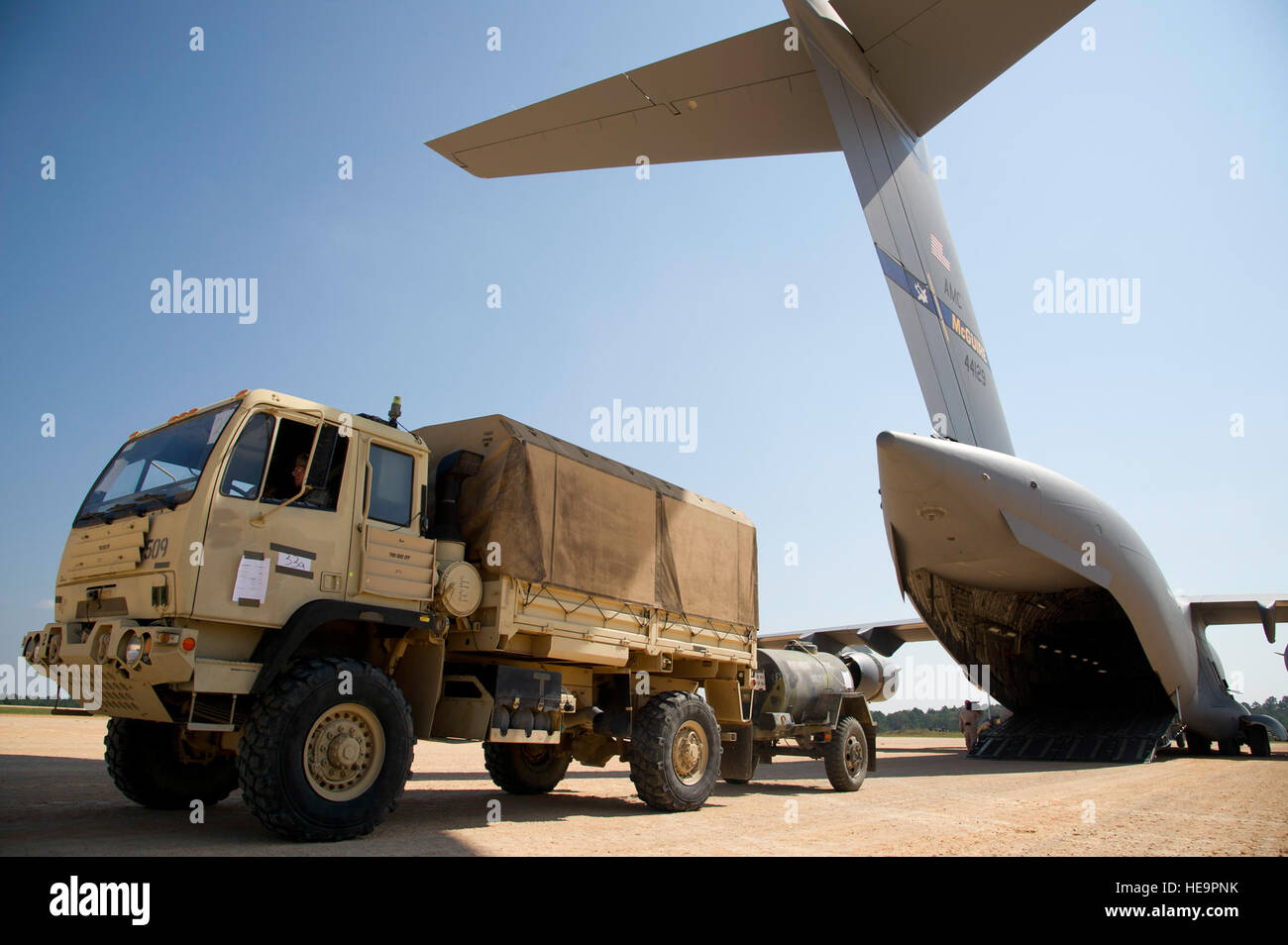 A U.S. Army M1078 Light Utility Truck performs an engine running ...