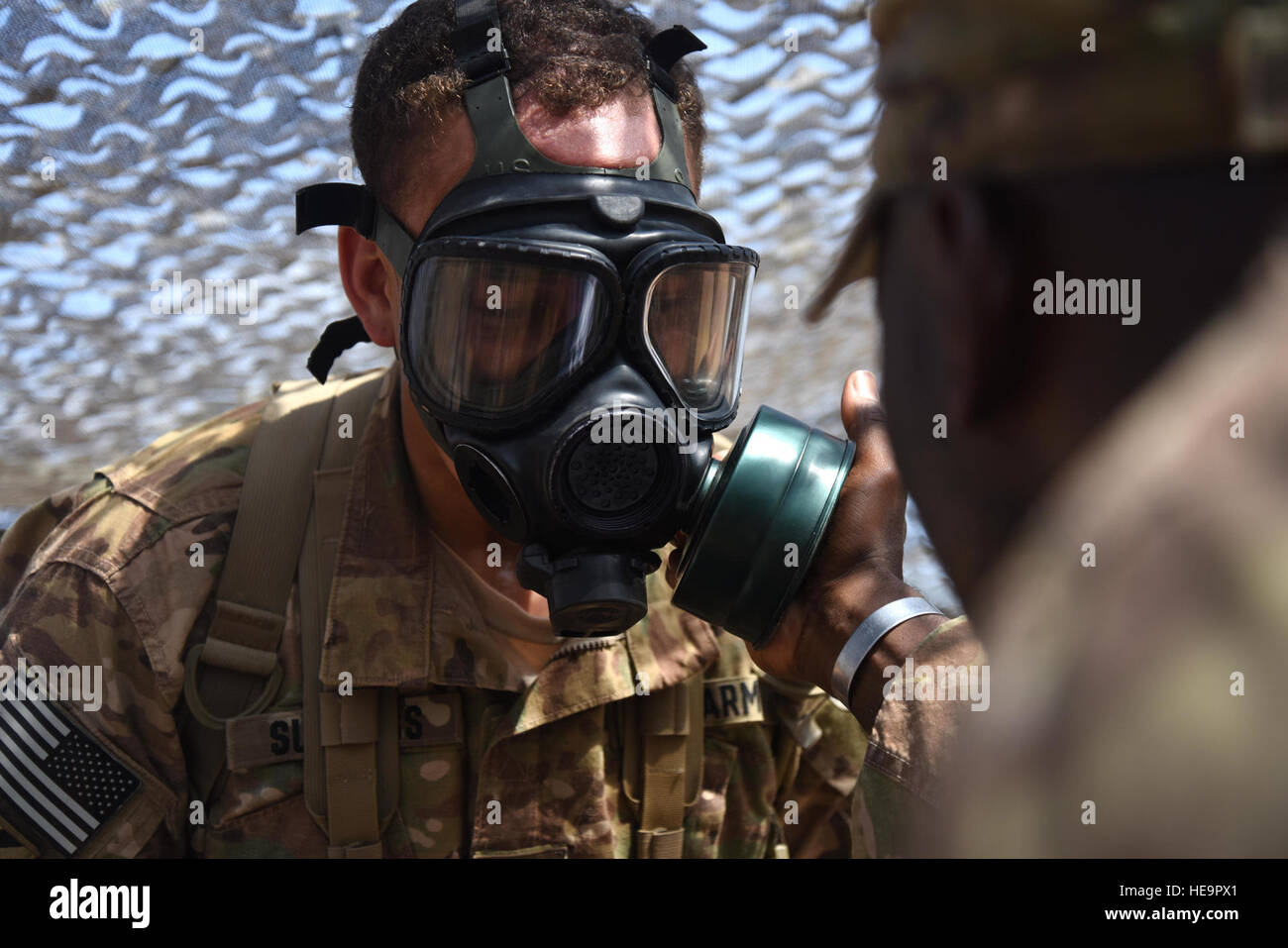 U.S. Army Expert Infantry Badge candidate completes a gas mask test ...