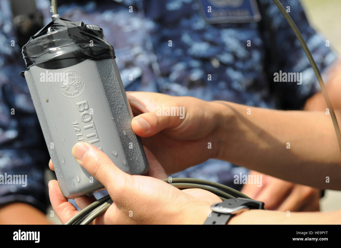 An explosive device is handled by a member of the Japanese Maritime ...