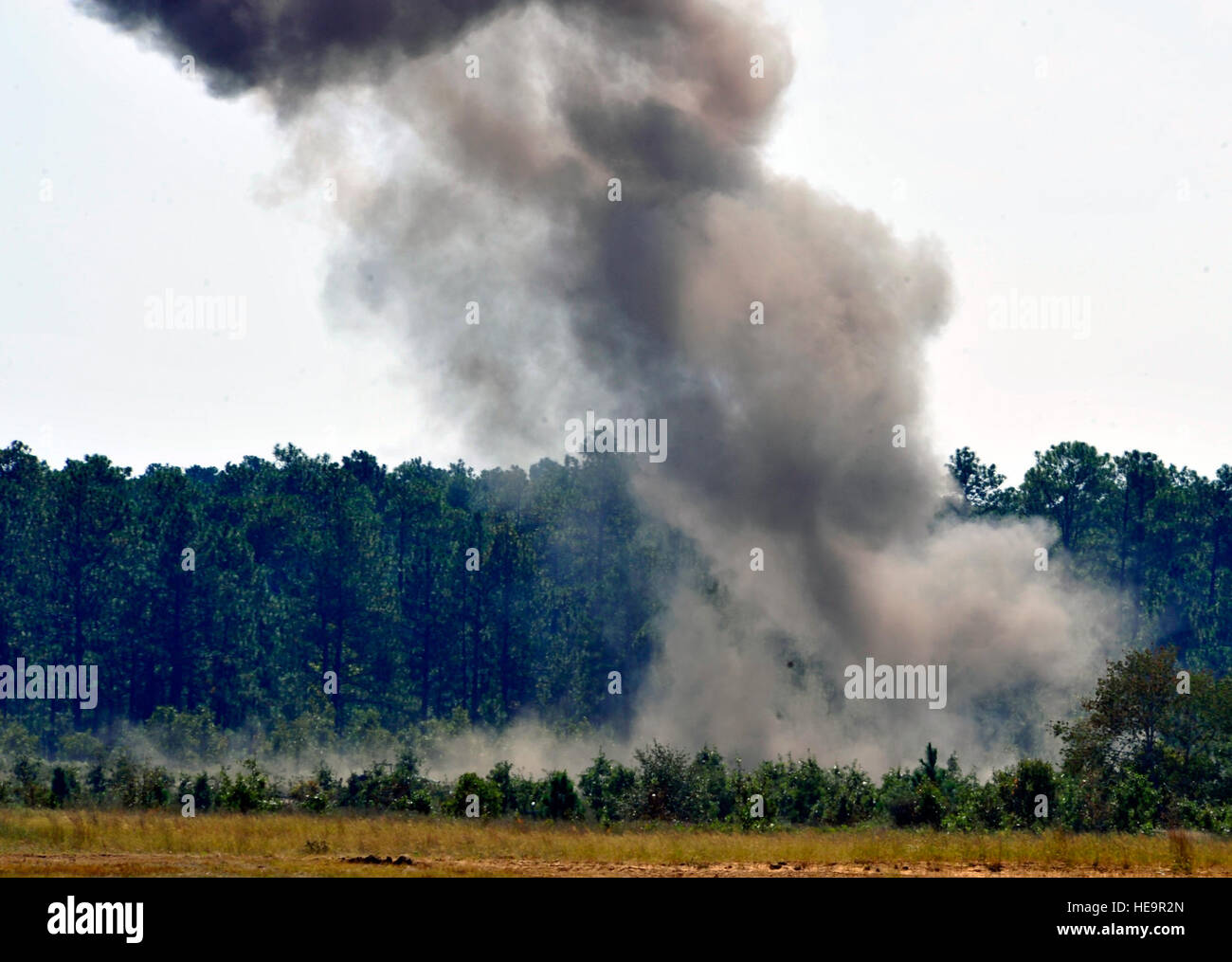 Smoke is seen in the distance as explosives are detonated by the 20th ...