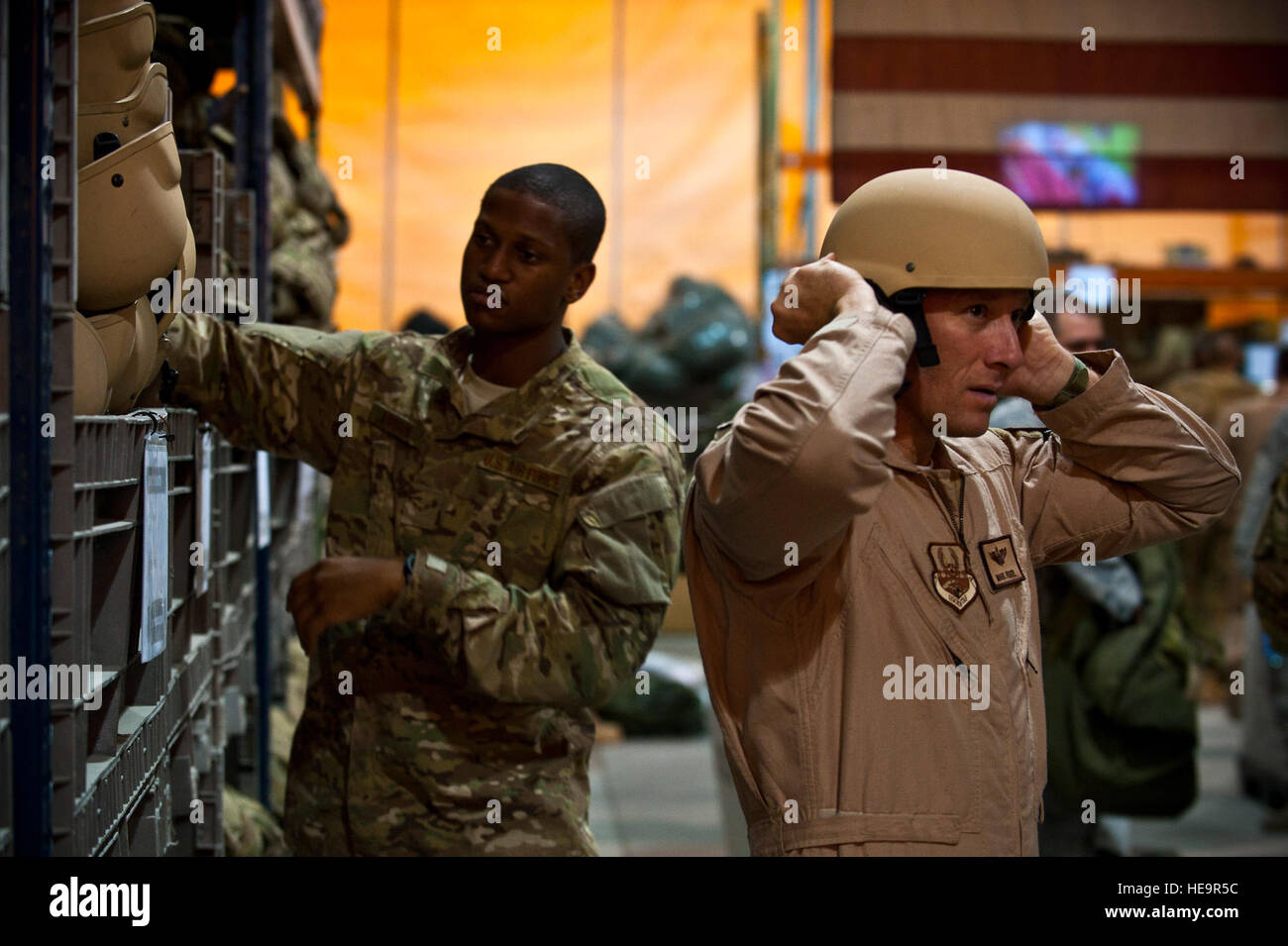 Airman 1st Class Brian Addison (left) and Maj. Mark Fissel try ...