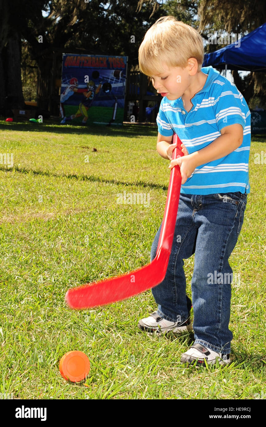 Lucas Helferich takes a swing at the Slap Shot game at the Child Find ...