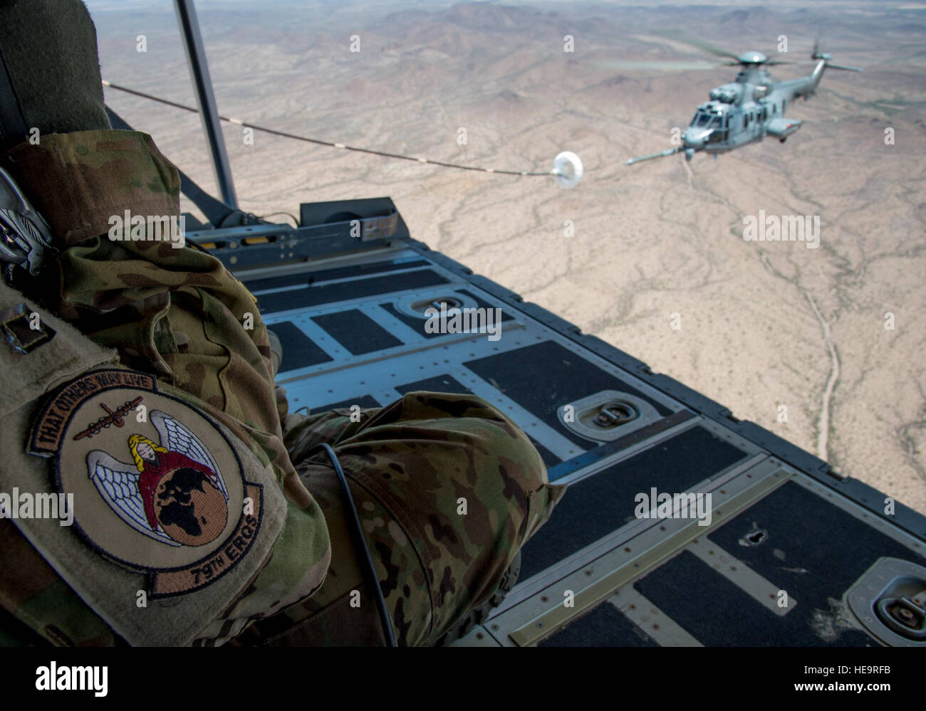 A French Air Force Eurocopter EC725 is refueled by a Lockheed HC-130J ...