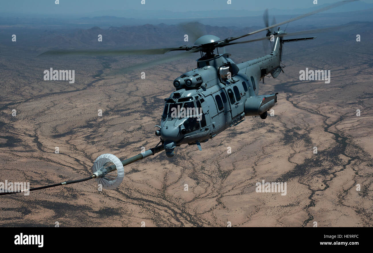 A French Air Force Eurocopter EC725 is refueled by a Lockheed HC-130J ...