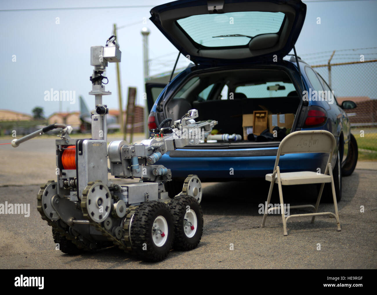 An Andros F6 robot is used to relay information to a remote explosive ...