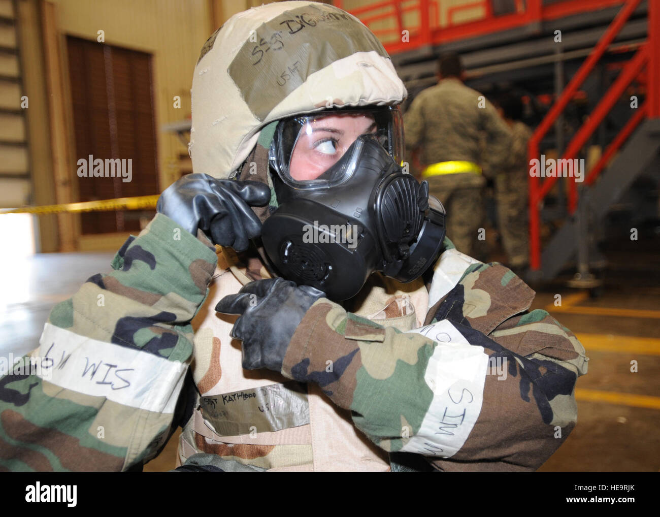 Staff Sgt. Kathleen DiGiovanni puts on her chemical gear during the ...