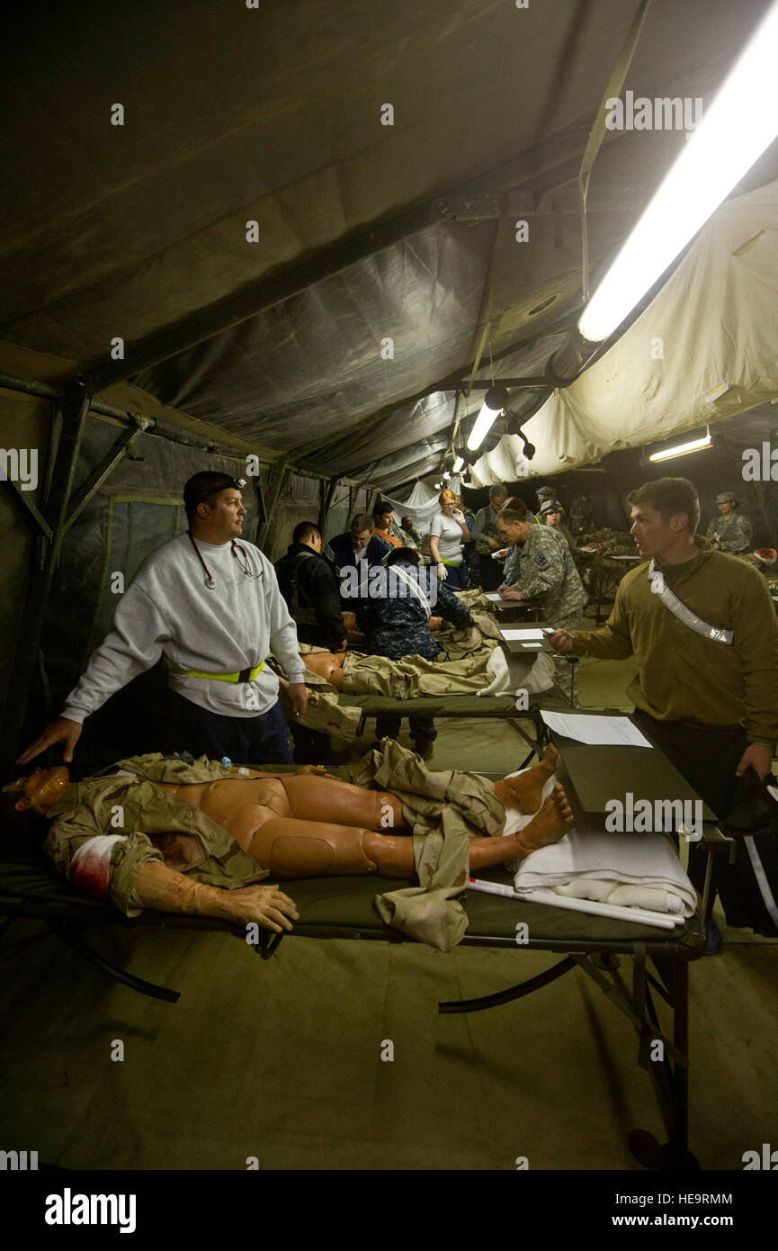 U.S. Air Force, Army, and Navy medical personnel triage simulated mass ...