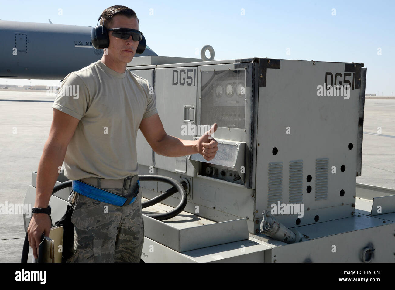 A KC-10 Extender crew chief conducts ground operations checks including ...