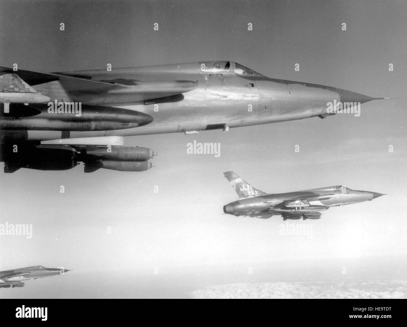 F-105 Thunderchiefs of the 355th Tactical Fighter Wing streak toward an ...