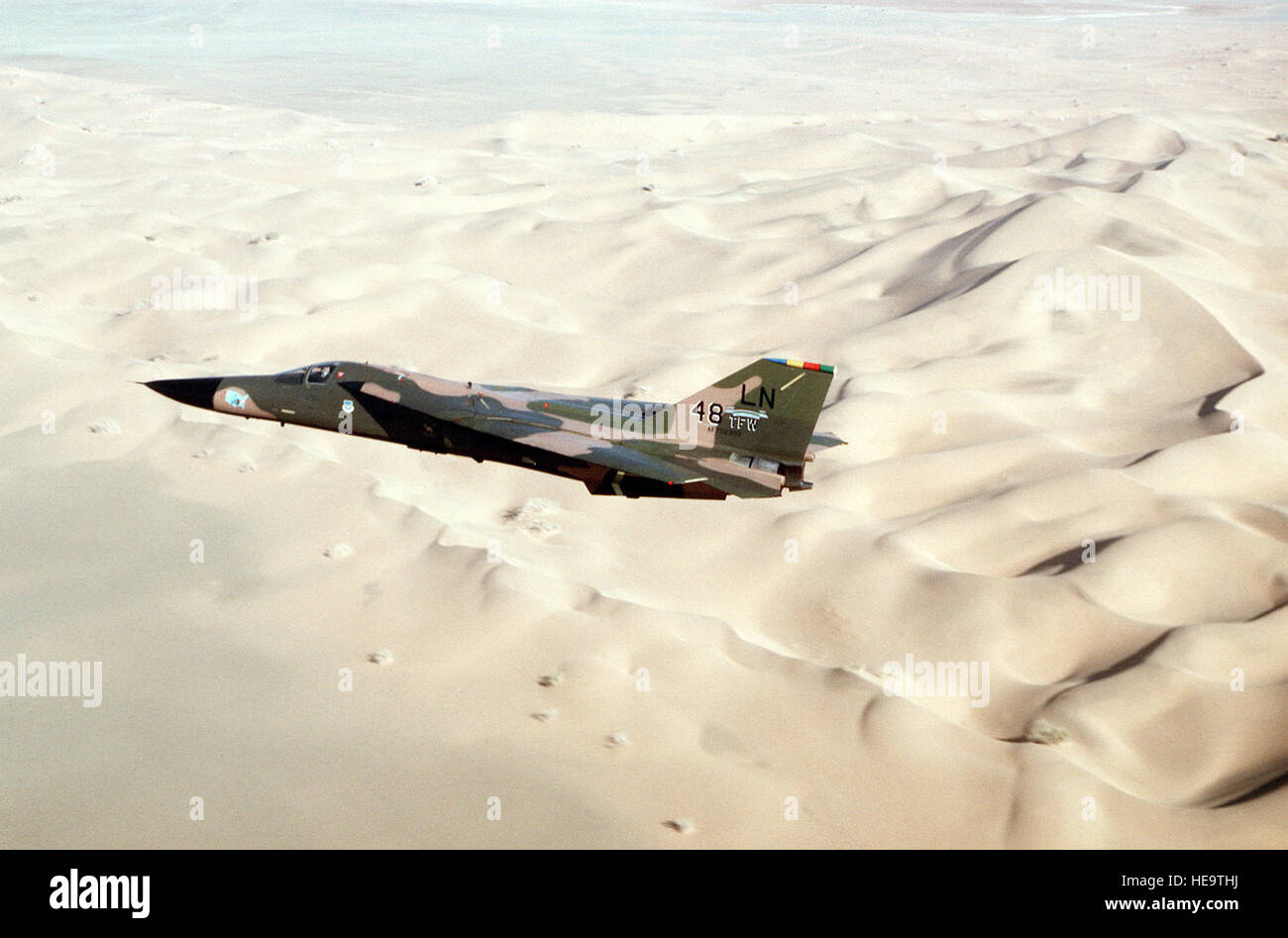 An F-111F aircraft from the 48th Tactical Fighter Wing flies over ...