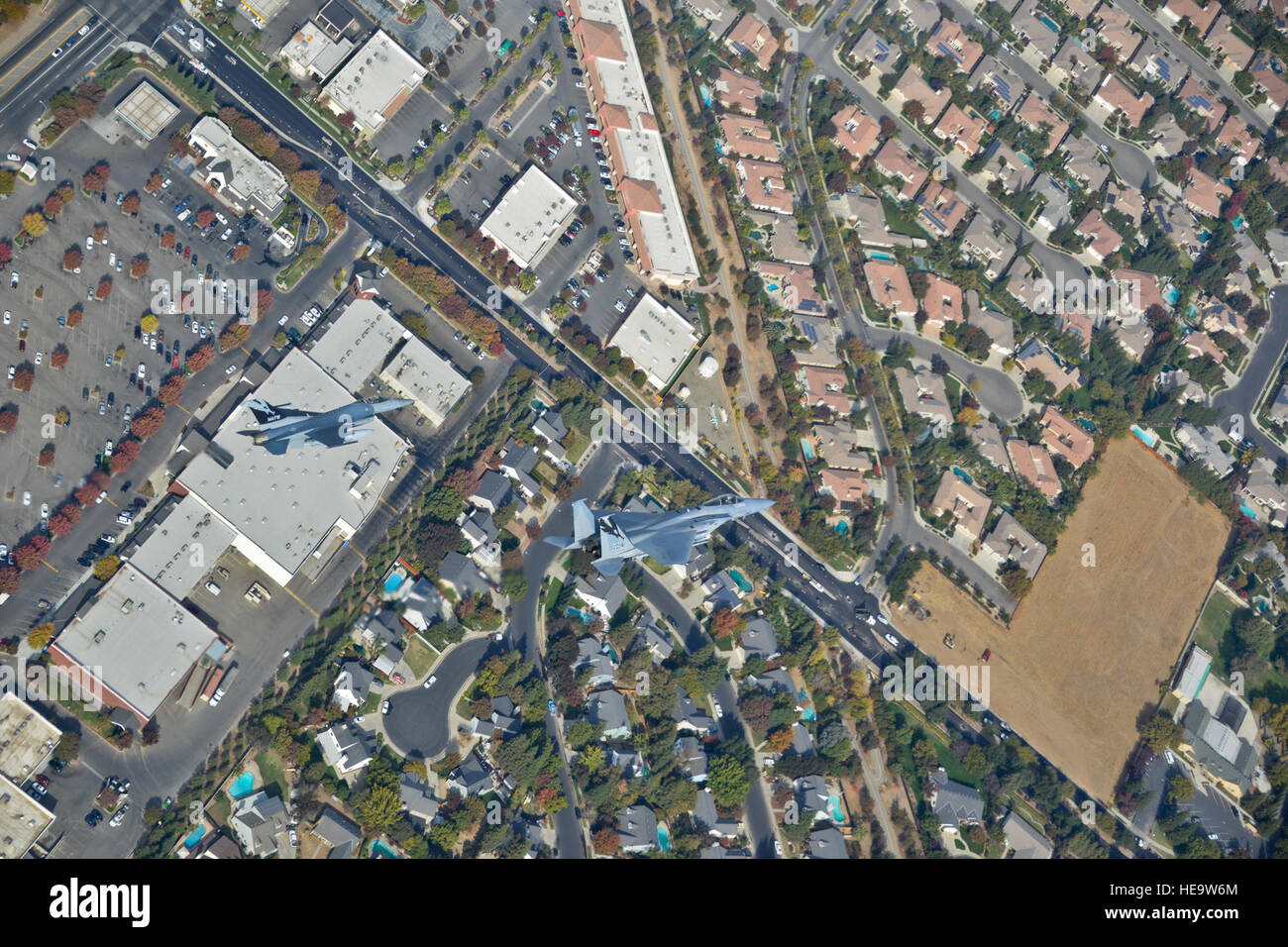 A U.S. Air Force F-15 Eagle and an F-16C Fighting Falcon fly over the ...