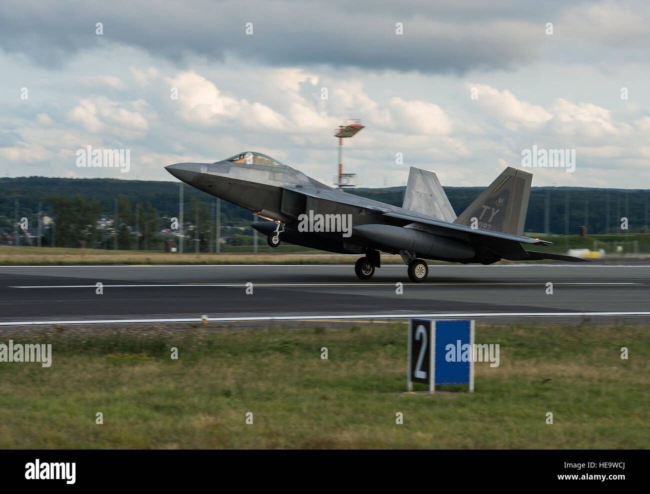 An F-22 Raptor lands at Spangdahlem Air Base, Germany, during its ...
