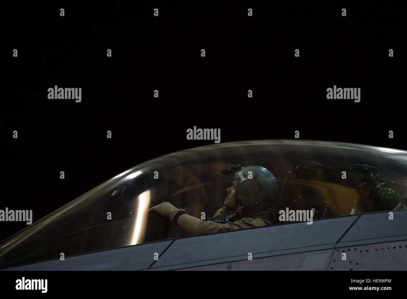 A U.S. Air Force F-22 Raptor pilot awaits the signal to taxi at an ...