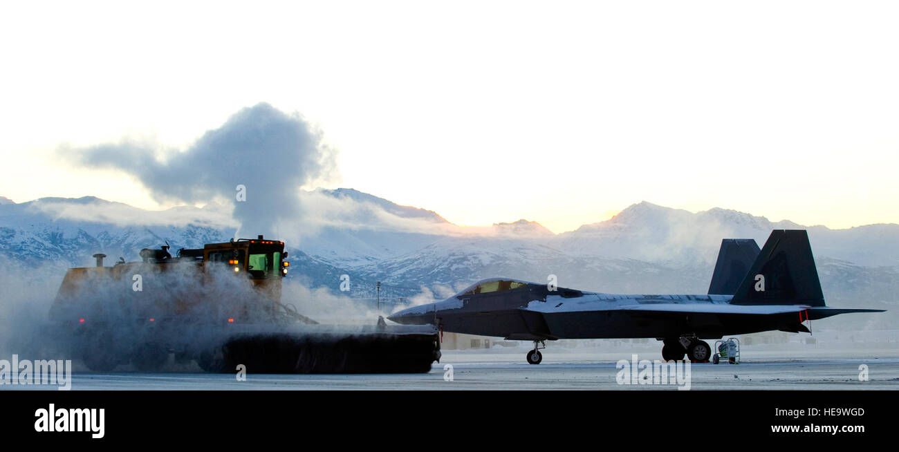 Airmen in the 3rd Civil Engineer Squadron snow removal flight maneuver ...
