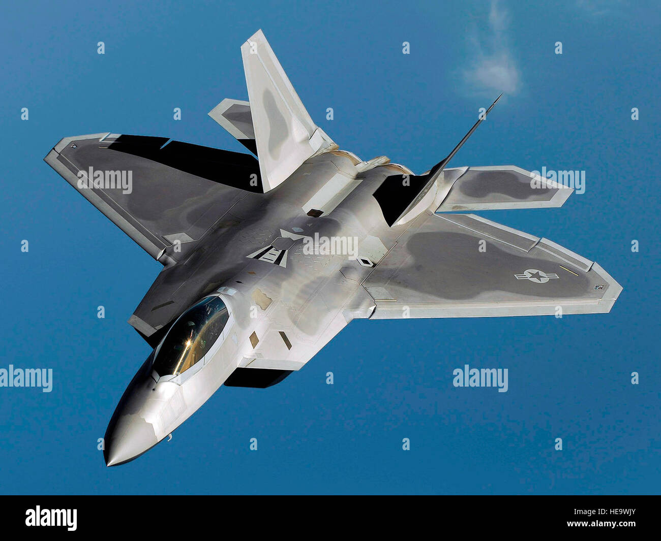 An F-22 Raptor flies over Kadena Air Base, Japan, Jan. 23 on a routine ...