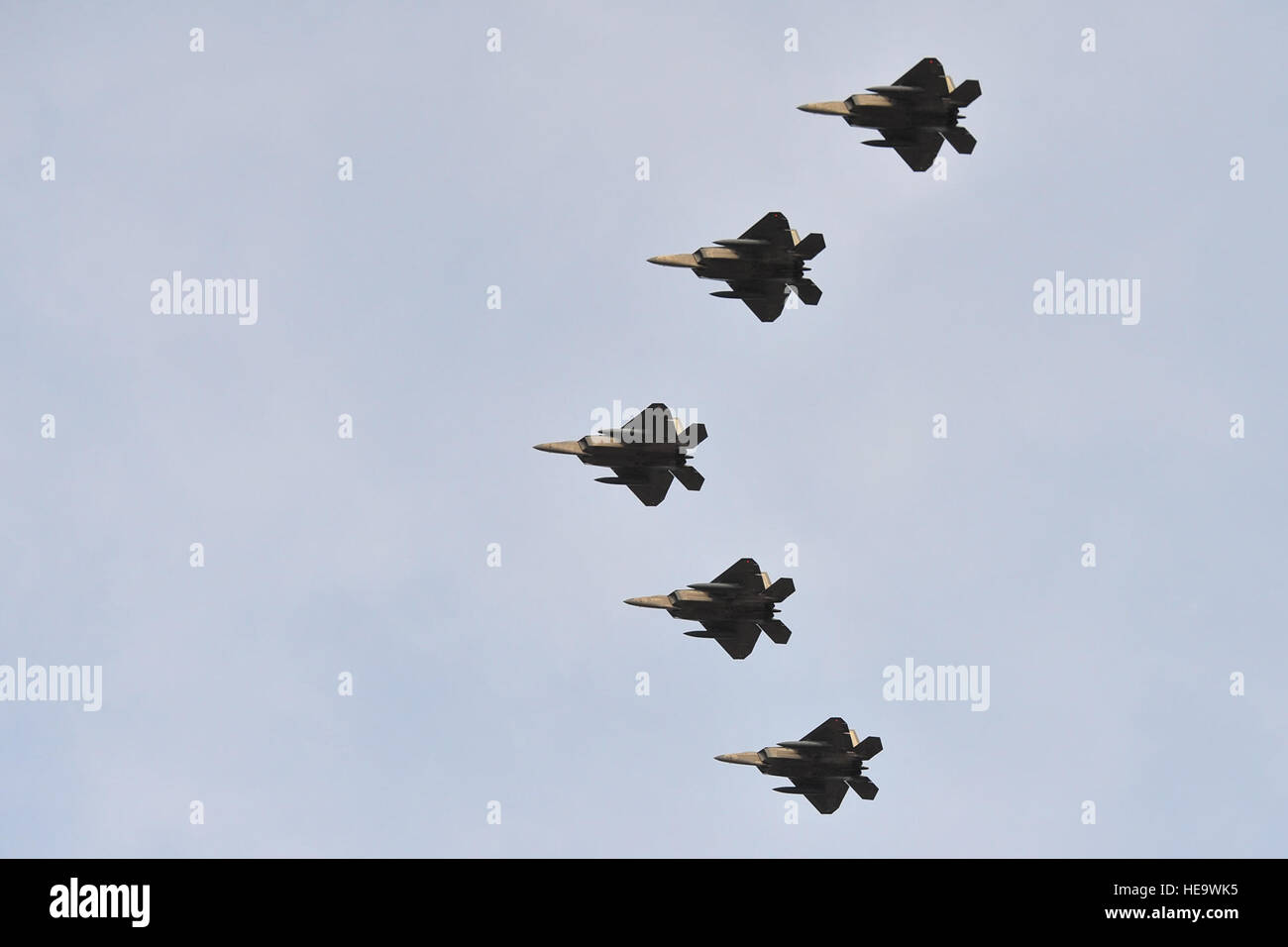 Five F-22 Raptors fly in formation over Tyndall Air Force Base during ...