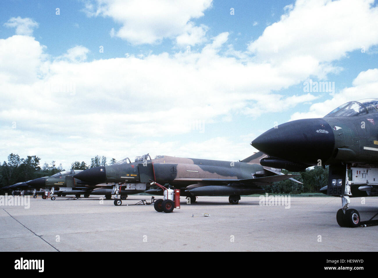 A left front view of F-4 Phantom II aircraft parked on the flight line ...